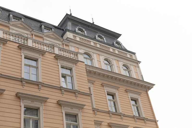 A Very Large and Impressive Building that Features a Balcony on Its Top ...