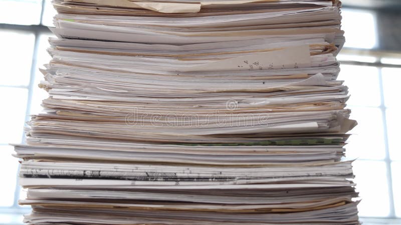 Stack of Paperwork. an Office Worker Holds a Large Stack of Paper in ...
