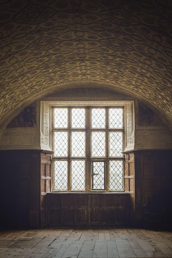 A Very Long Room with a Large Arched Window with Lots of Light Stock Photo - Image of glowing ...