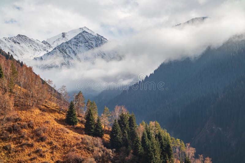 Very Low Clouds Touch the Peaks of the Almaty Autumn Mountains Stock ...