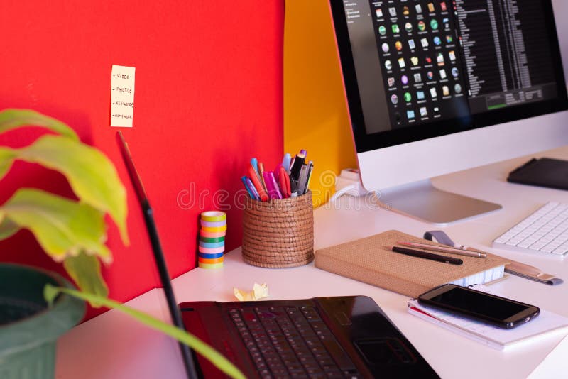 A Very Modern and Colorful Workplace with Technological Devices and ...