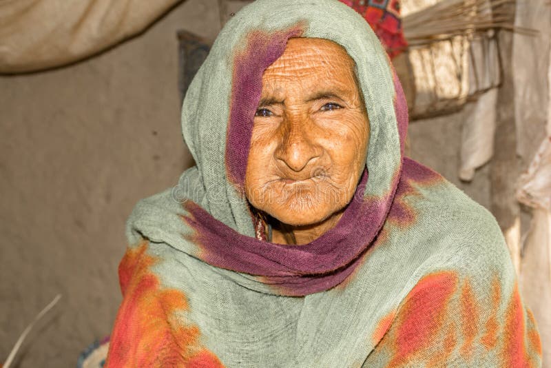 A Very Old Asian Woman with a Sad Expression and Wrinkles on Her Face ...