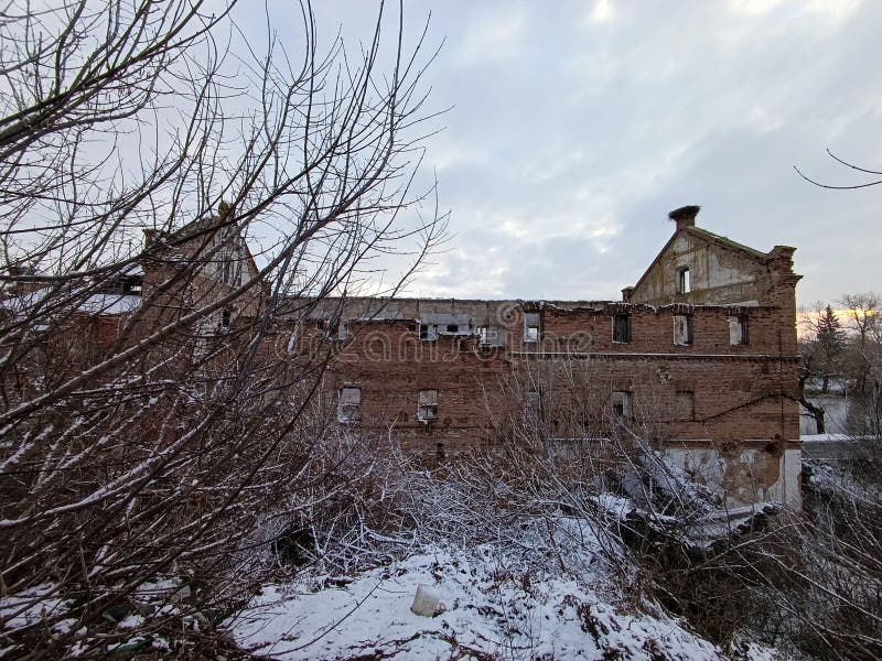 A Very Old Building with a Lot of Snow on the Ground Stock Image ...