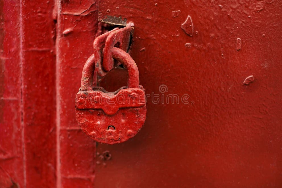 Red door with red lock stock image. Image of architecture - 144561689