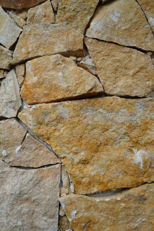A Very Old Rock Wall with Cracks and Chips All Over it Stock Photo ...