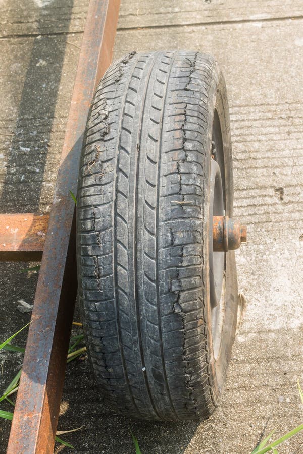 Old tire with rusty wheel stock photo. Image of vintage - 135602418