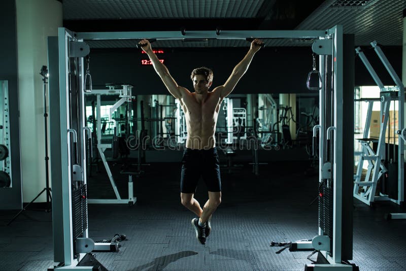 Very Power Athletic Guy , Execute Exercise Tightening on Horizontal Bar ...