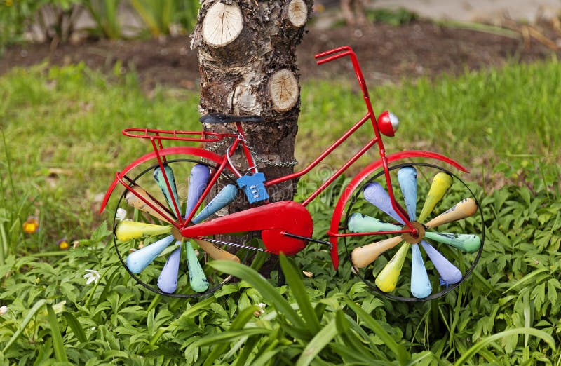Very Small Colorful Bike Locked with Chain in a Tree Stock Photo ...
