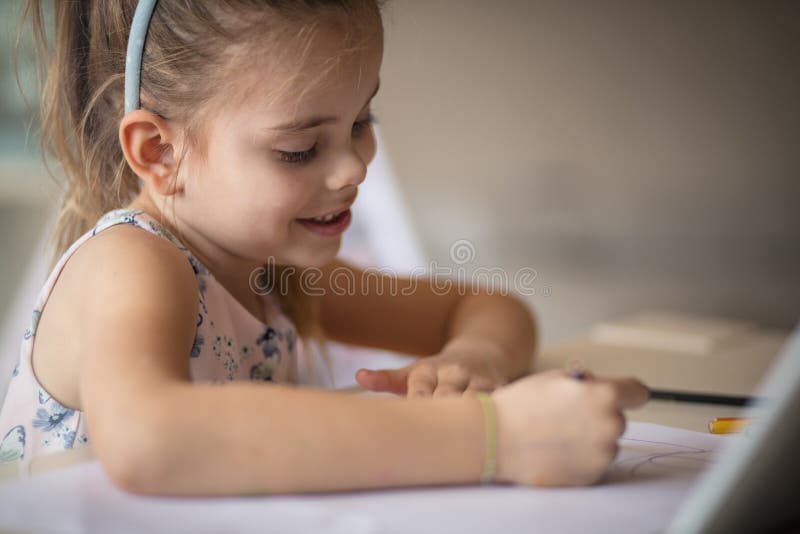 She is very smart stock image. Image of ipod, book, house - 146007003