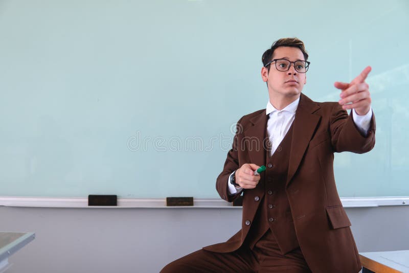 Very Smartly Dressed College Professor Pointing To the Class. Caucasian ... Very Smartly Dressed College Professor Pointing To the Class. Caucasian ...