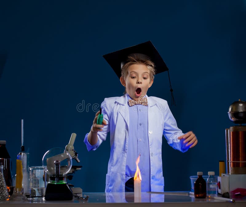 Smiling Boy Conducting Experiment in Chemistry Lab Stock Photo - Image ...