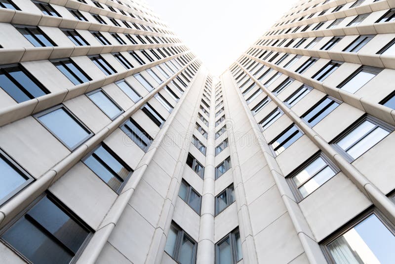 Very Tall White Building with Glass Windows Seen from Below Stock Image ...