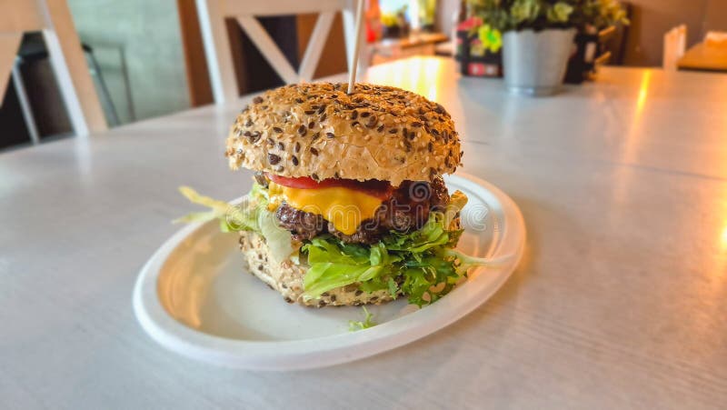 Very Tasty Cheeseburger with Tomateoes Lettuce and Pickles Stock Photo ...
