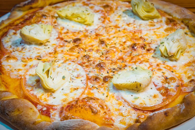 Very tasty pizza in a cafe stock photo. Image of cheese - 104446386