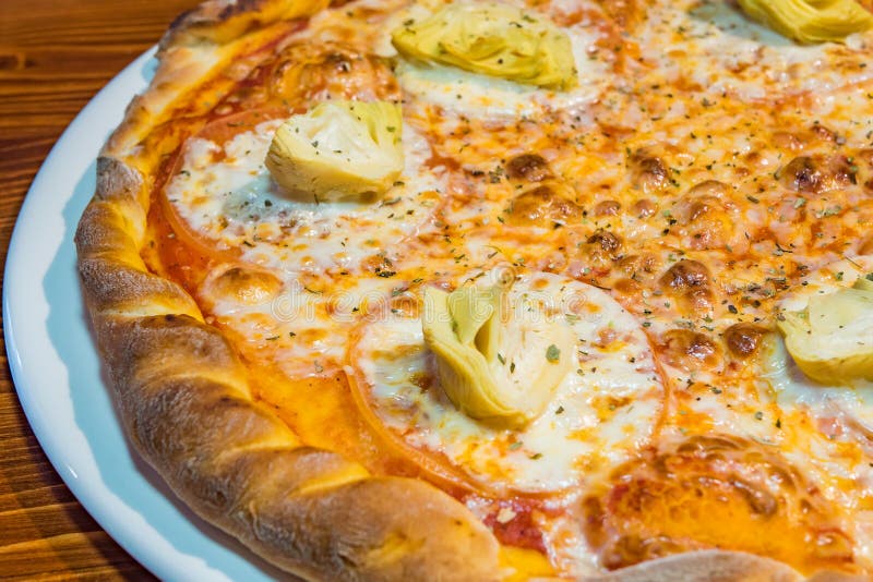 Very tasty pizza in a cafe stock photo. Image of gourmet - 104446398