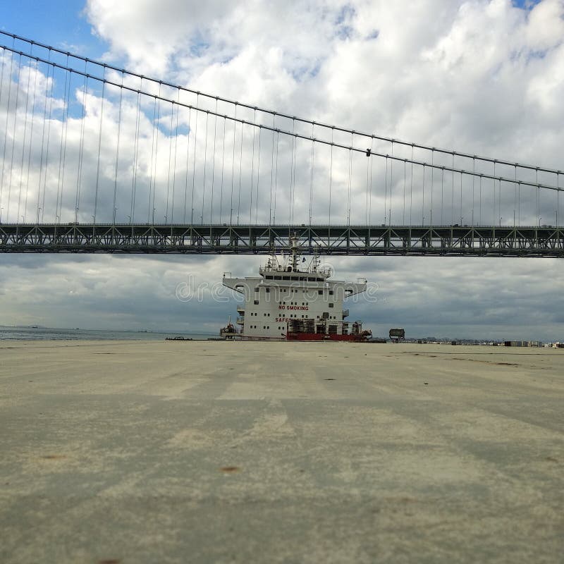 A vessel crossing bridge stock photo. Image of water - 256505220