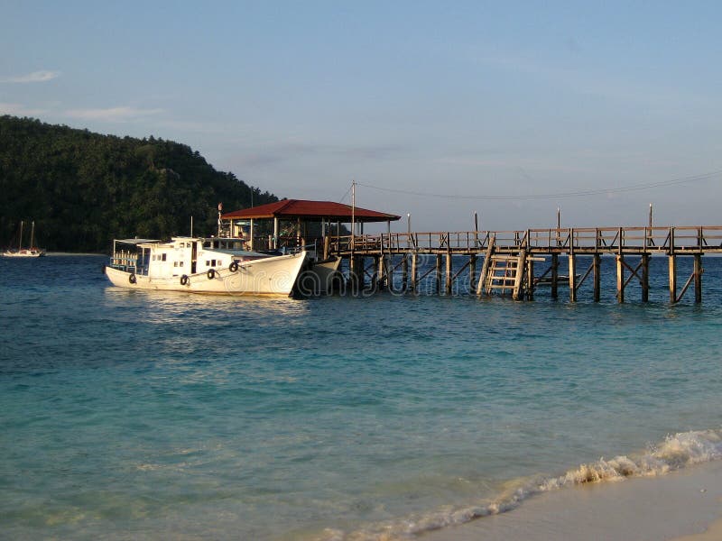 A Vessel Docking at a Jetty Stock Photo - Image of boats, conveyance ...