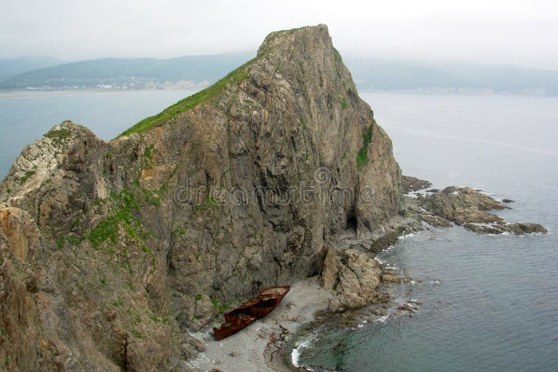 Vessel Wrecked Near a Sea Rock Stock Image - Image of calm, landscape ...