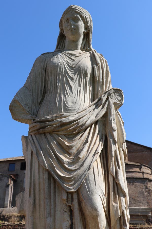 Statue of a Vestal Virgin at the Roman Forum Against Blue Sky Stock ...