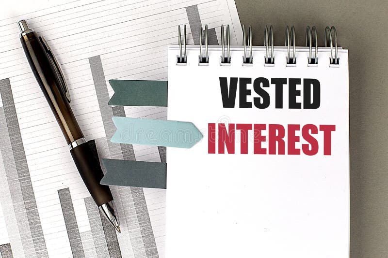 VESTED INTEREST Text on Notebook with Chart on Gray Background Stock ...