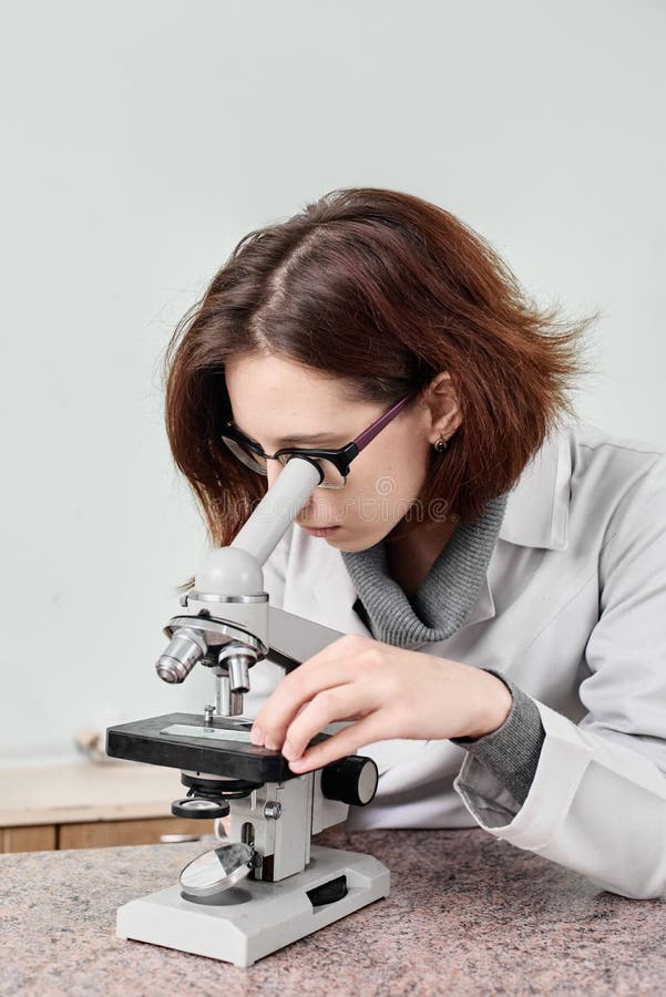 Vet doctor with microscope stock photo. Image of research - 115855416