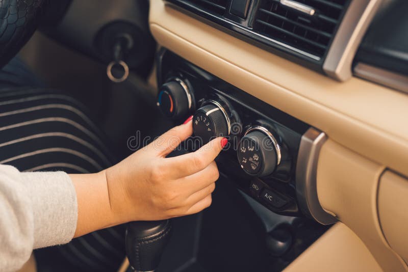 VHand of Woman Turning on Car Air Conditioning System,Button on ...