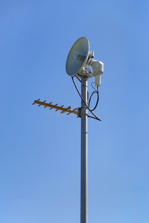 VHF, UHF, Microwave Antennas on Pole Against Blue Sky. Stock Image ...