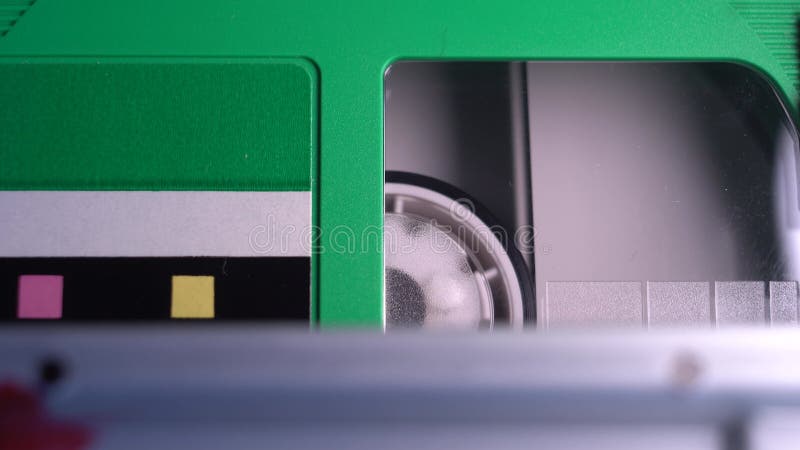 Video Cassette Tape Starts Rolling in VHS Player Recorder, Macro Close ...