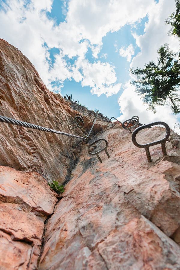 Via Ferrata Climbing Path with Metal Wire and Steps Going Up a Mountain ...