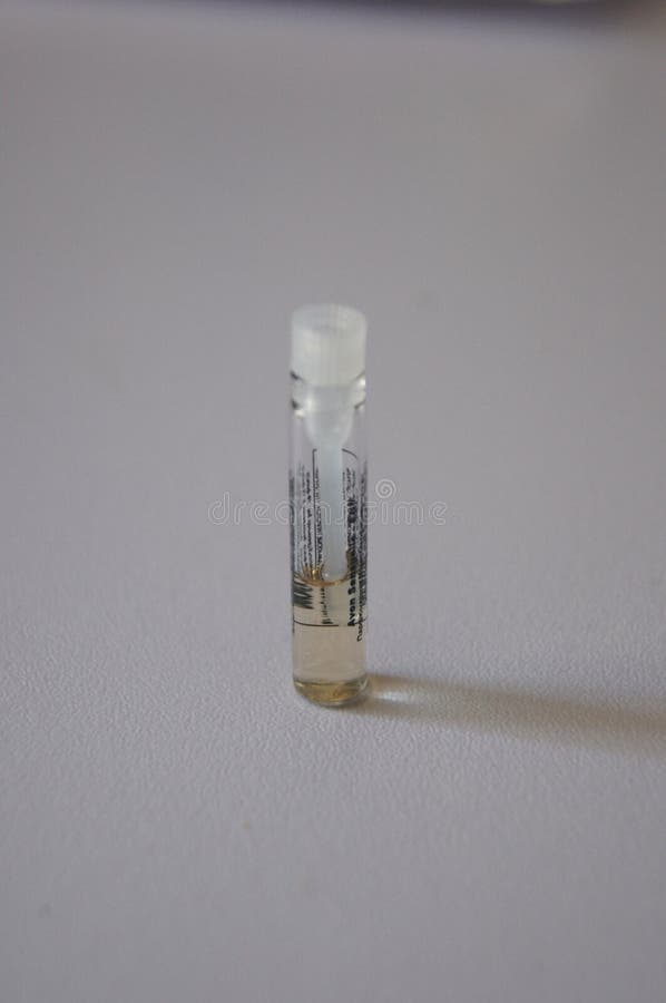 A Vial with Clear Liquid on Blurred Lab Background. Stock Image - Image ...