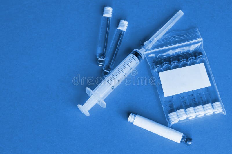 Vials with a Cure for the Disease, 3 Ml, a Plastic Syringe with a ...