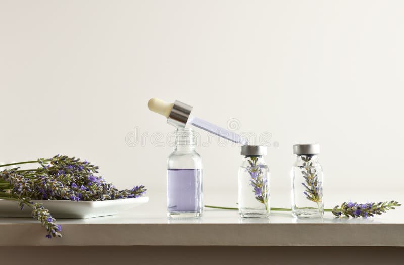 Vials with Lavender Essence Preparation on Laboratory Bench White ...
