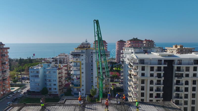 Aerial Video: Aerial Shot of Construction Progress with Cranes in Motion and Concrete Floors ...