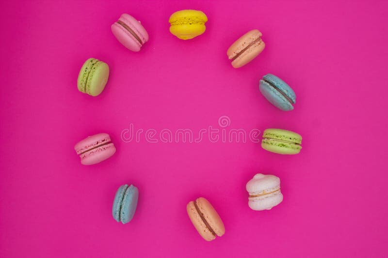 Circle of Colorful Macarons on Pink Background Stock Photo - Image of ...