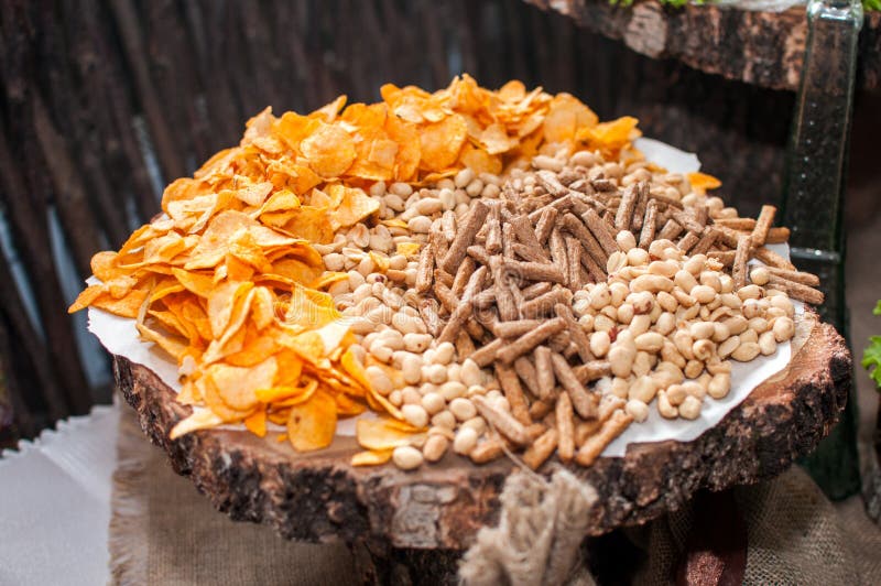 Vibrant Array of Crunchy Snacks on Rustic Wooden Platter Stock Photo ...