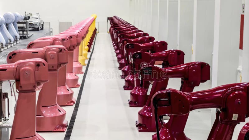 A Vibrant Assembly Line Showcasing a Variety of Colored Robotic Units ...