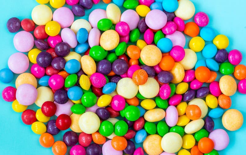 Vibrant Assortment of Colorful Candy-coated Chocolates on a Blue ...