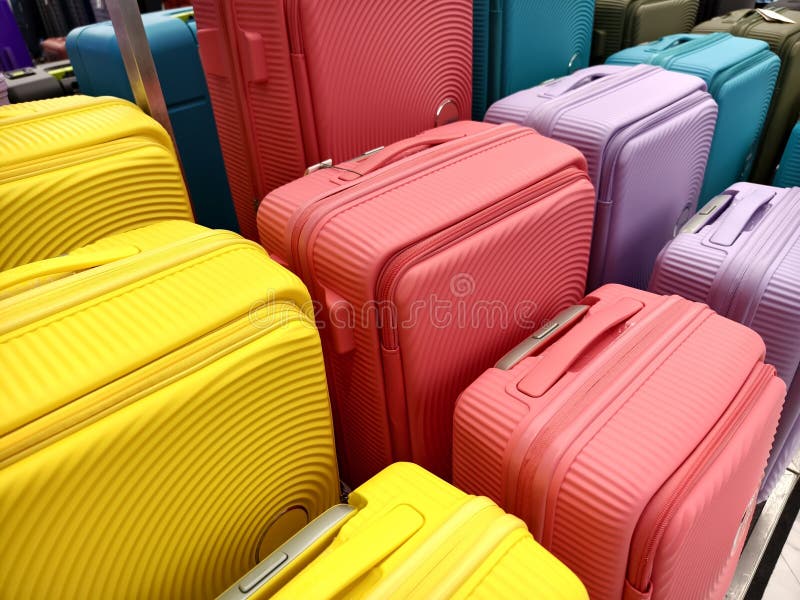 A Vibrant Assortment of Suitcases is Carefully Arranged in a Pile Stock ...
