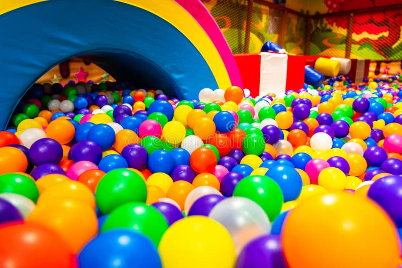 A Vibrant Ball Pit Filled with Colorful Balls and a Rainbow Soft ...