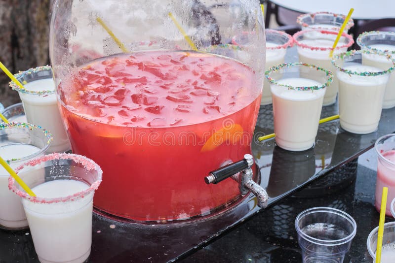 A Vibrant Batch of Lemonade Served beside Decorated Cups. Reflects the ...