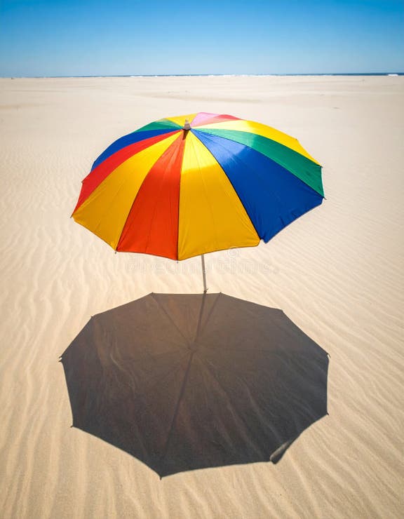 A Vibrant Beach Umbrella Dramatically Casting a Long, Sharp Shadow ...