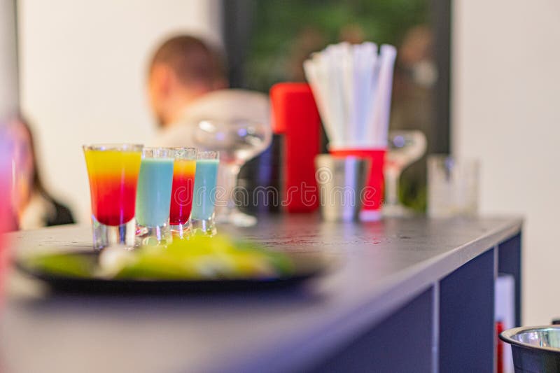 A Vibrant, Bustling Bar Setting Featuring Colorful Cocktails in Various ...