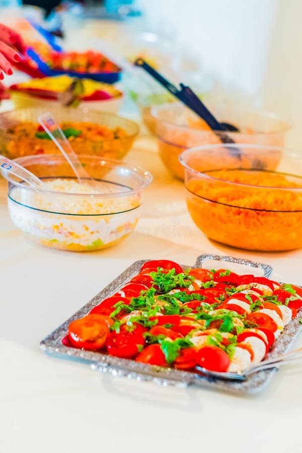 Vibrant Caprese Salad and Assorted Side Dishes on a Table at a Buffet ...
