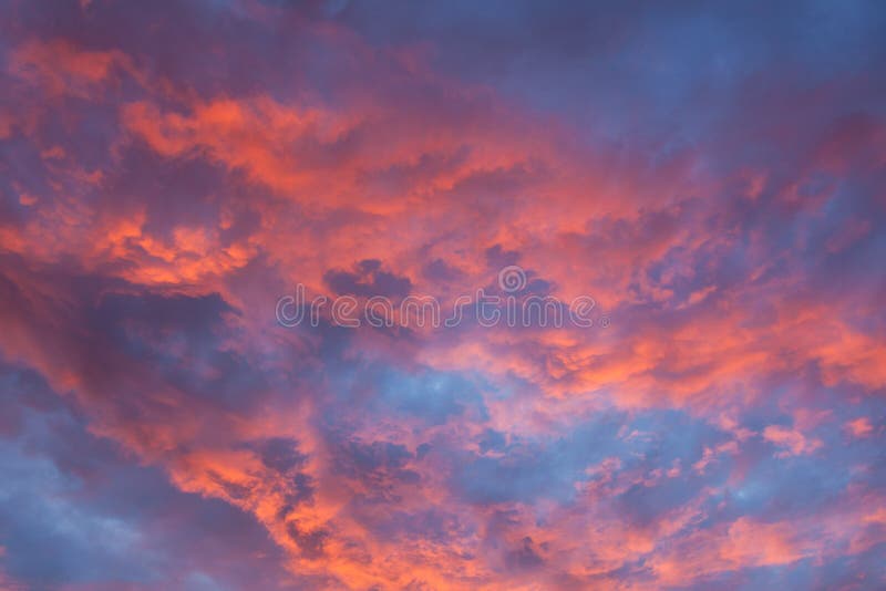 Vibrant clouds at sunset stock image. Image of scenic - 114945663