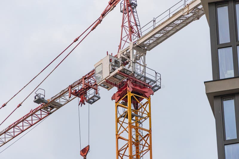 A Vibrant Construction Site with an Active Yellow Crane and Building ...