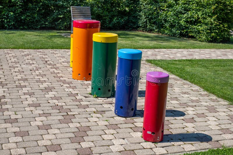 Colorful Cylindrical Structures in a Park Setting on a Sunny Day ...