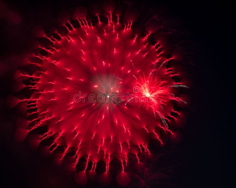 Vibrant Display of Red Fireworks Exploding Against a Dark Night Sky ...