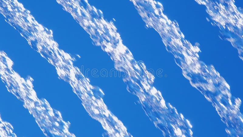 Vibrant Display of Water Streams Against a Bright Blue Sky, Creating a ...