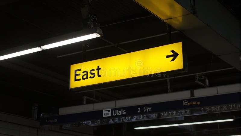Vibrant East Sign with Arrow at Train Station Stock Illustration ...