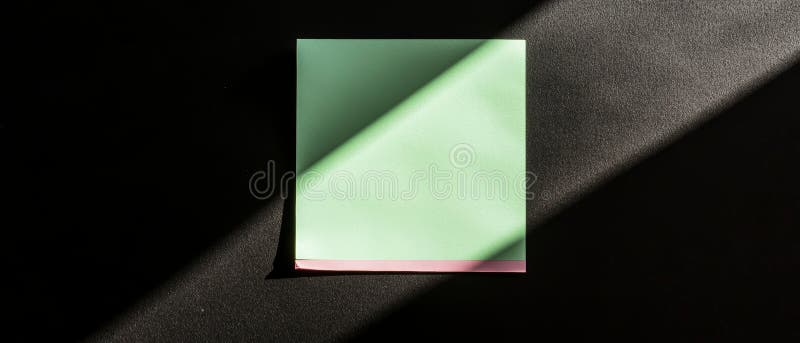 Emerald Green Sticky Note Soft Light and Shadow Play on a Dark ...